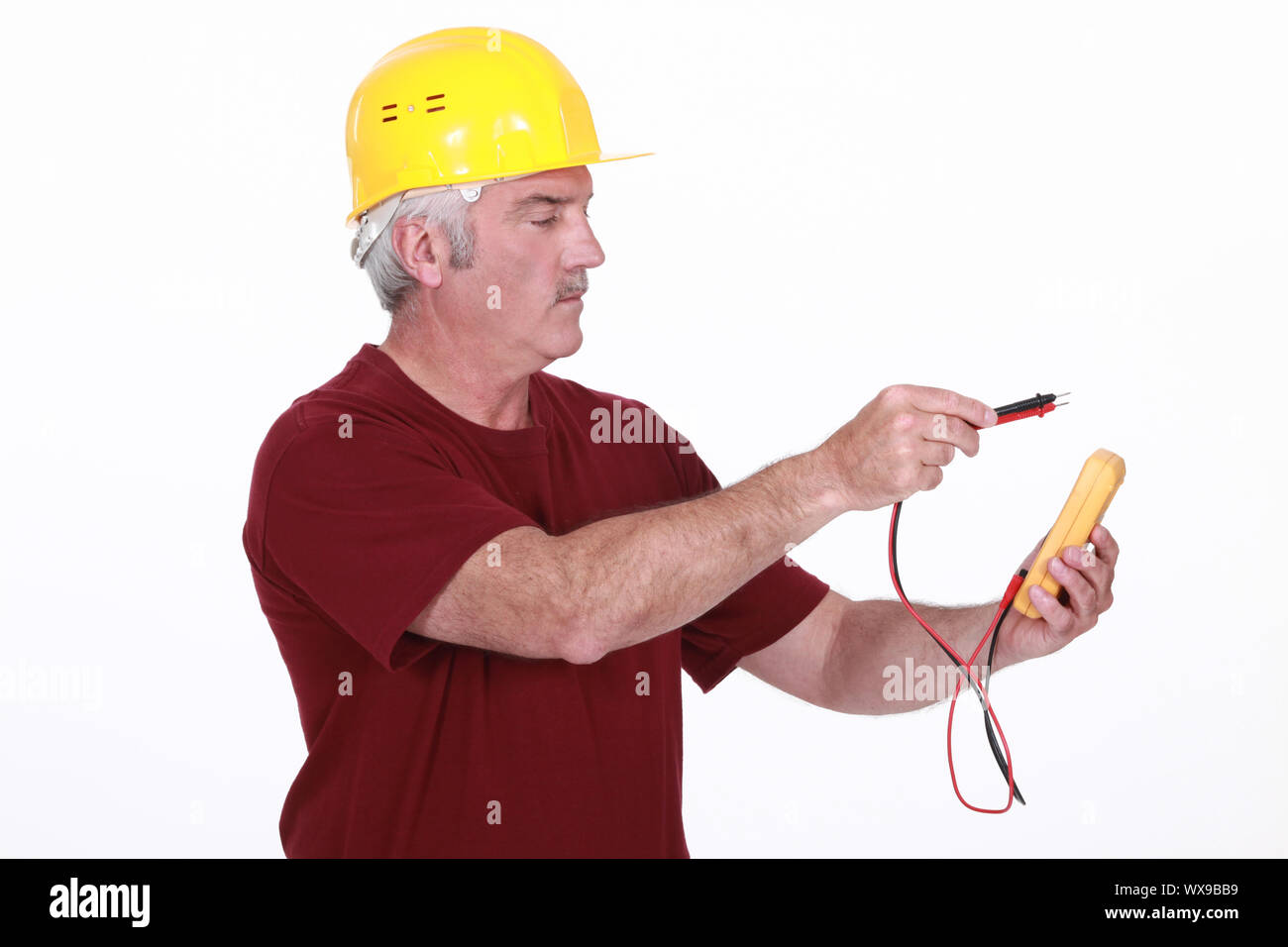 Electrician using multimeter Stock Photo - Alamy