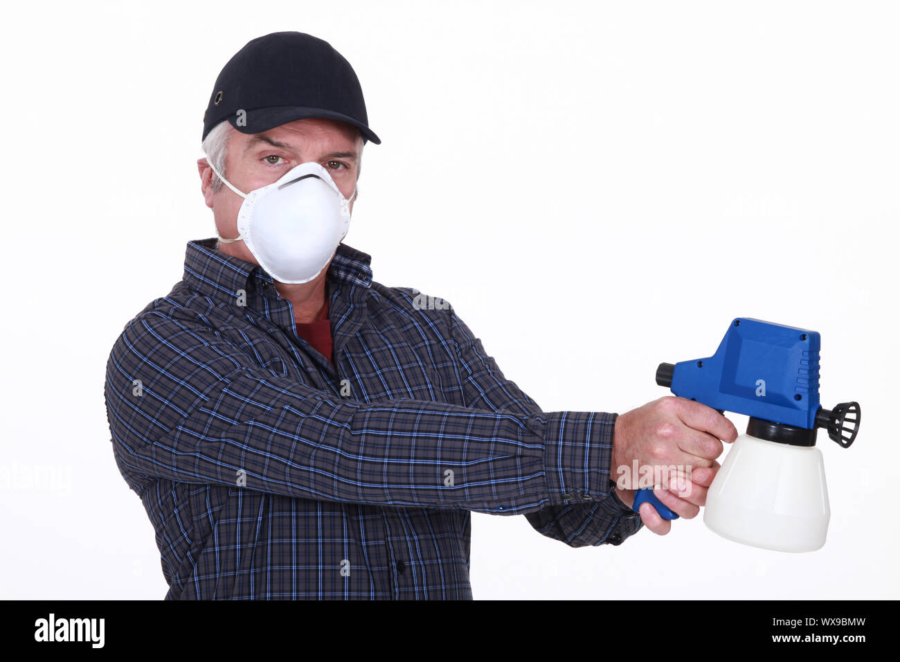 Man with a paint sprayer Stock Photo - Alamy