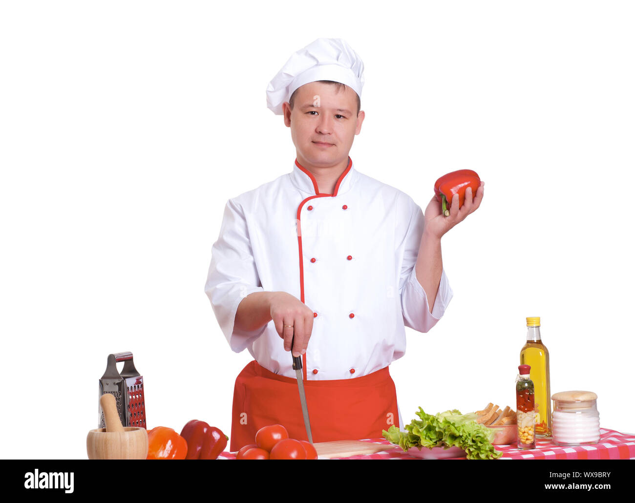 Handsome man cooking in the kitchen, white background Stock Photo - Alamy