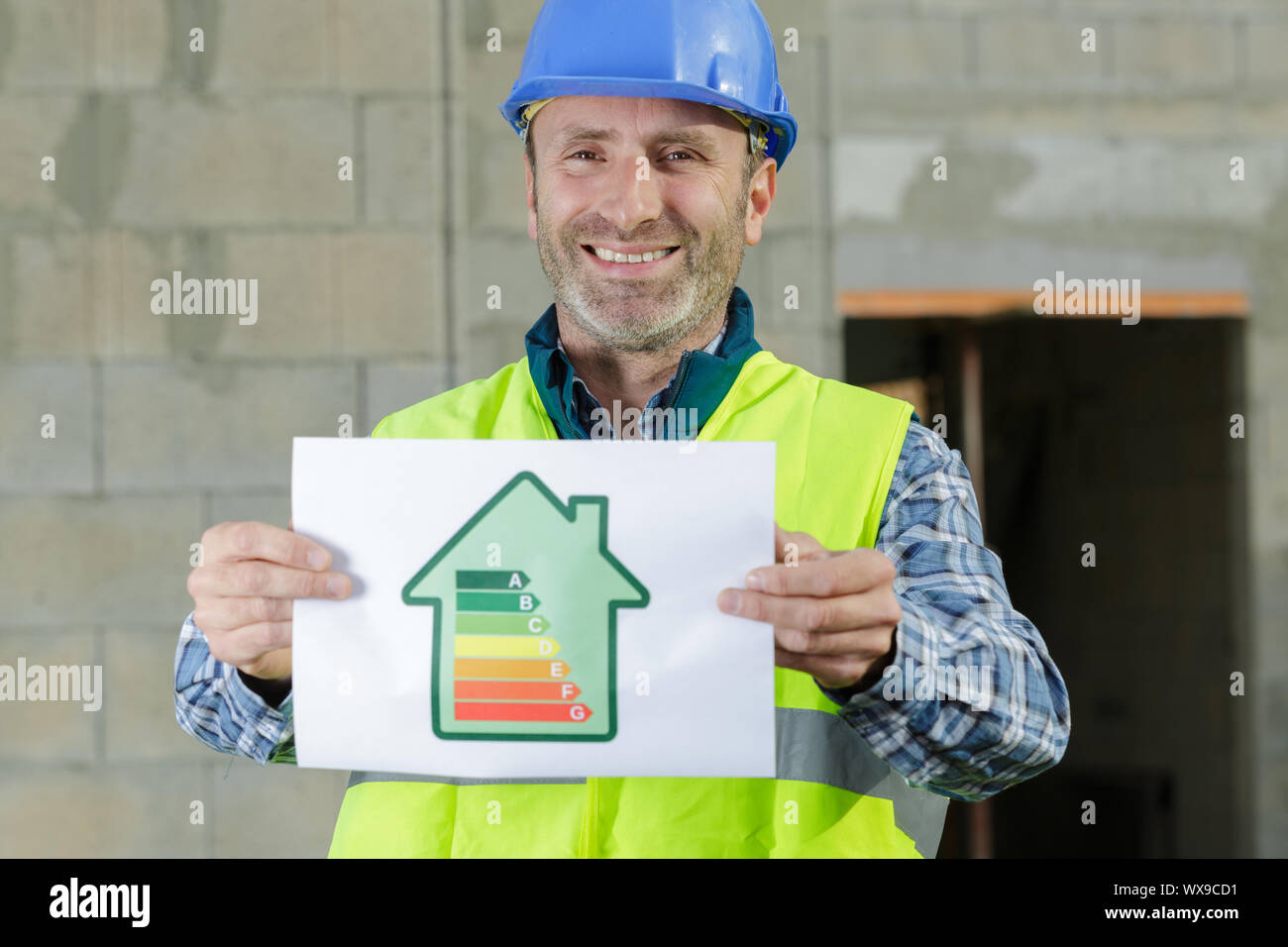 builder showing energy efficient chart Stock Photo - Alamy