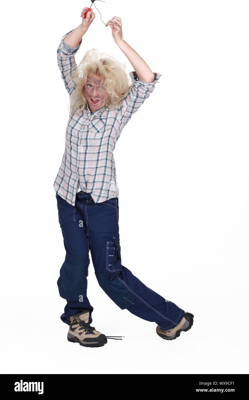 Woman getting an electric shock Stock Photo - Alamy