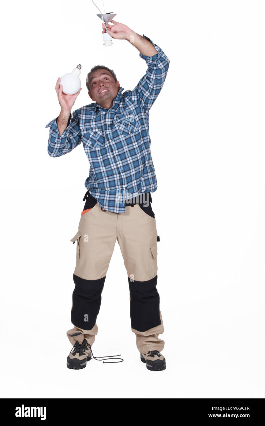 electrician fixing a bulb Stock Photo - Alamy
