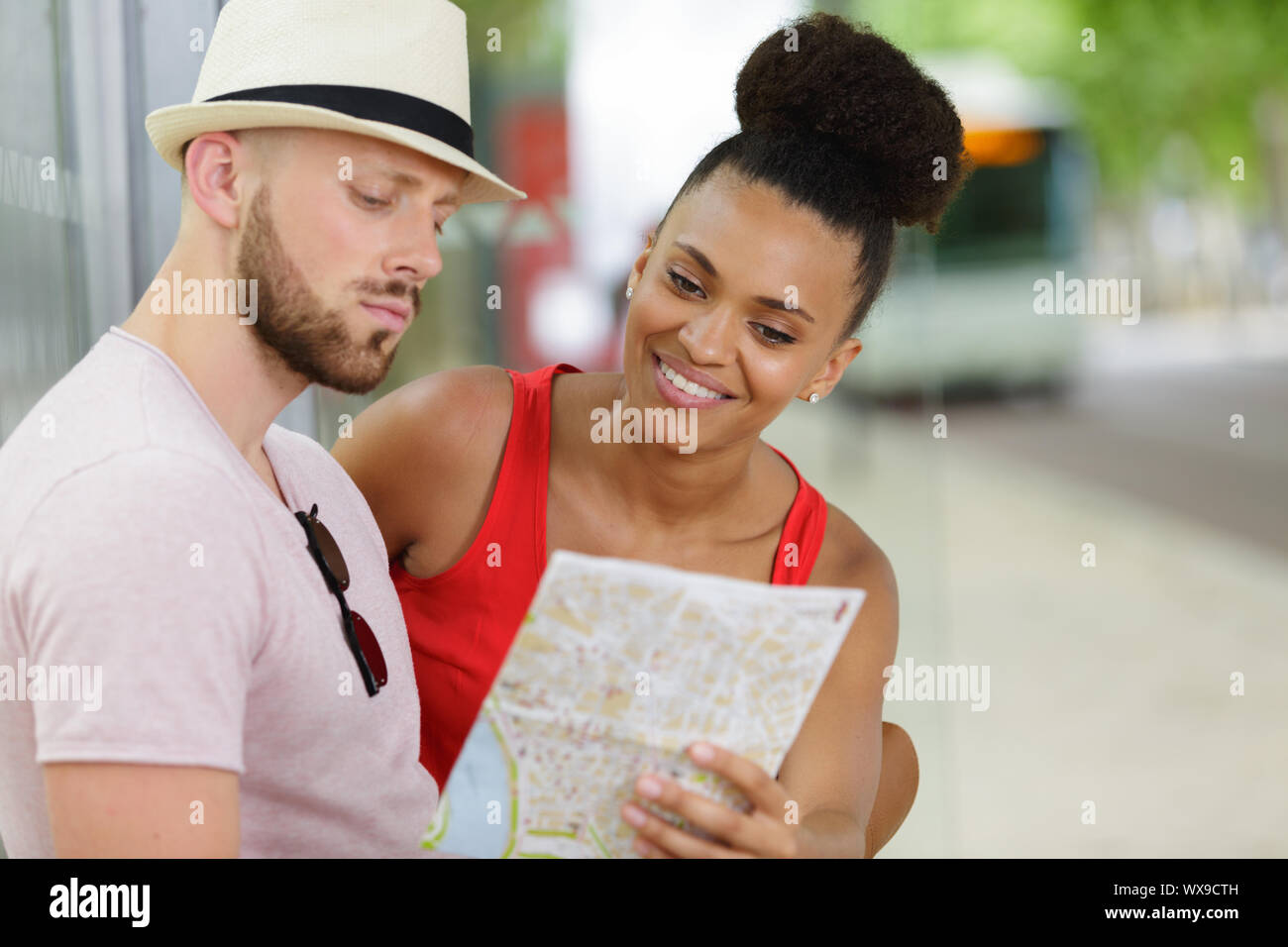 young couple studying a map Stock Photo - Alamy