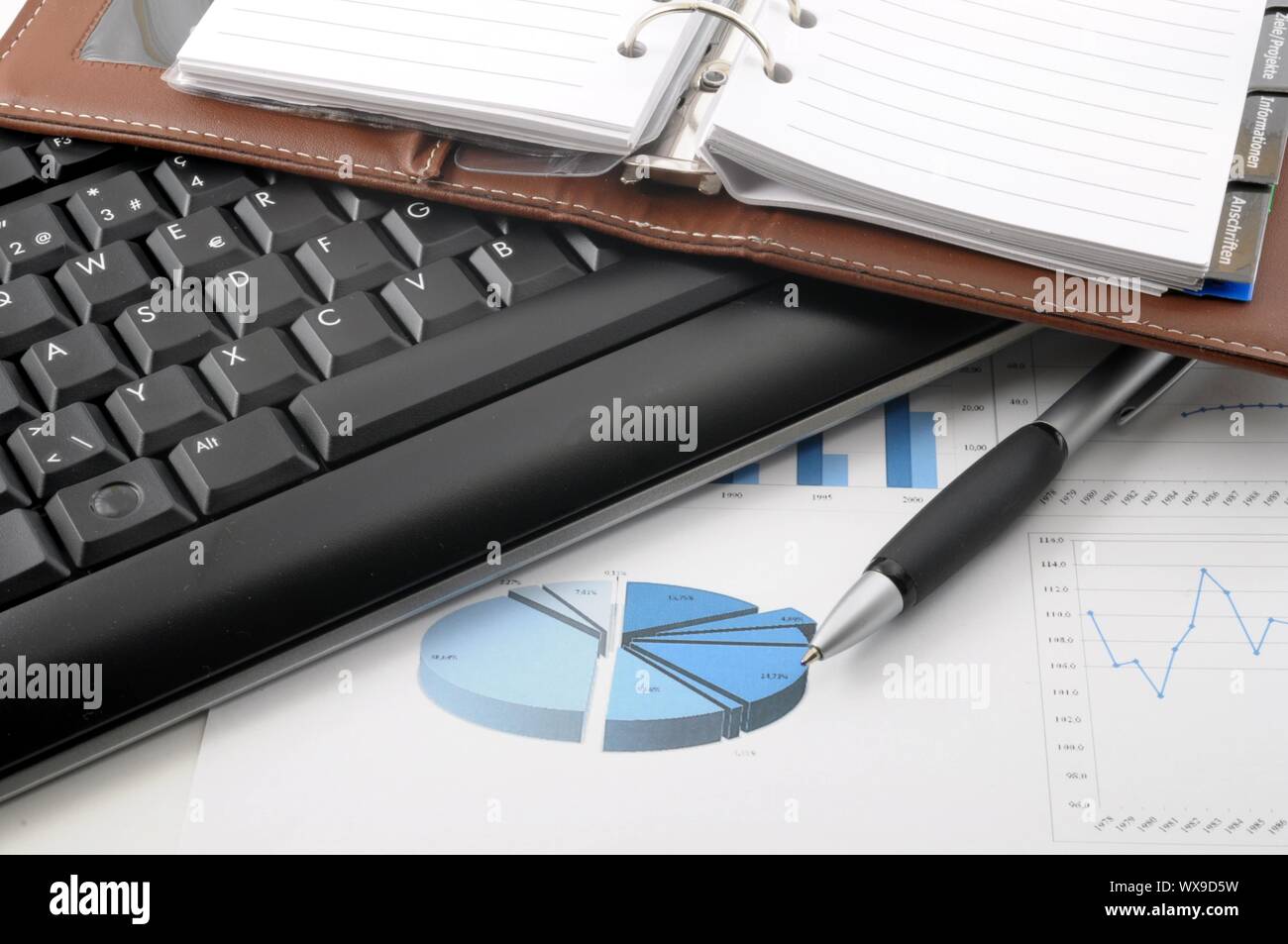 paperwork in office and computer keyboard showing success Stock Photo ...