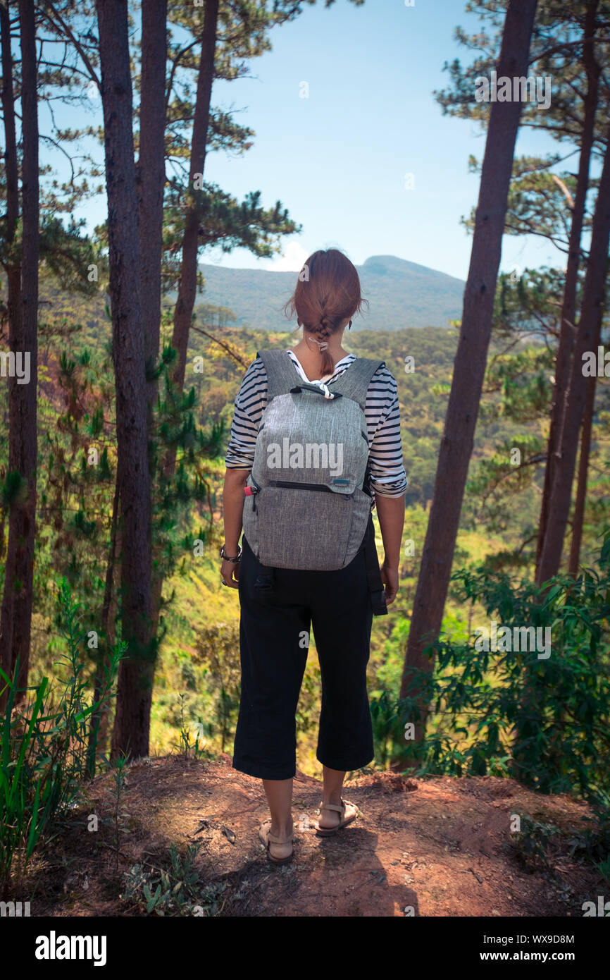 Tourist with backpack in highland Stock Photo - Alamy