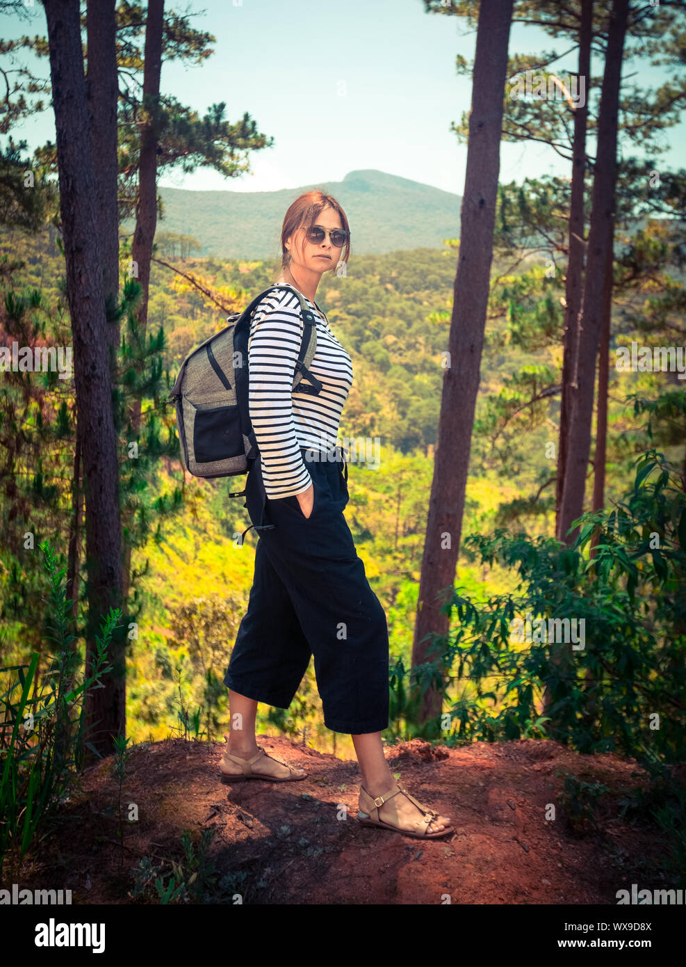 Tourist with backpack in highland Stock Photo - Alamy