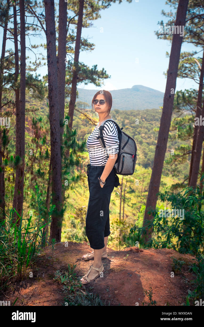 Tourist with backpack in highland Stock Photo - Alamy