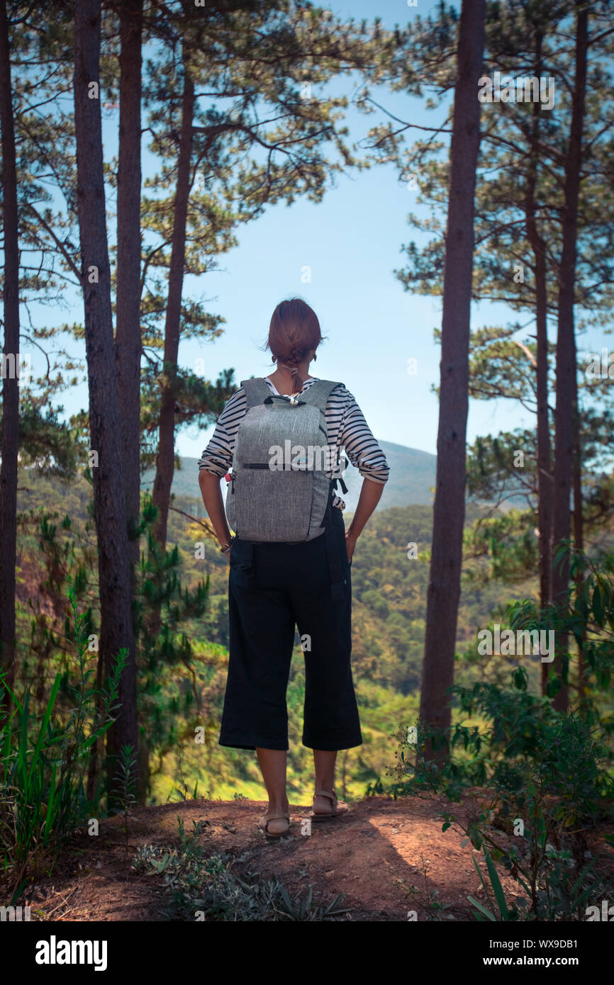 Tourist with backpack in highland Stock Photo - Alamy