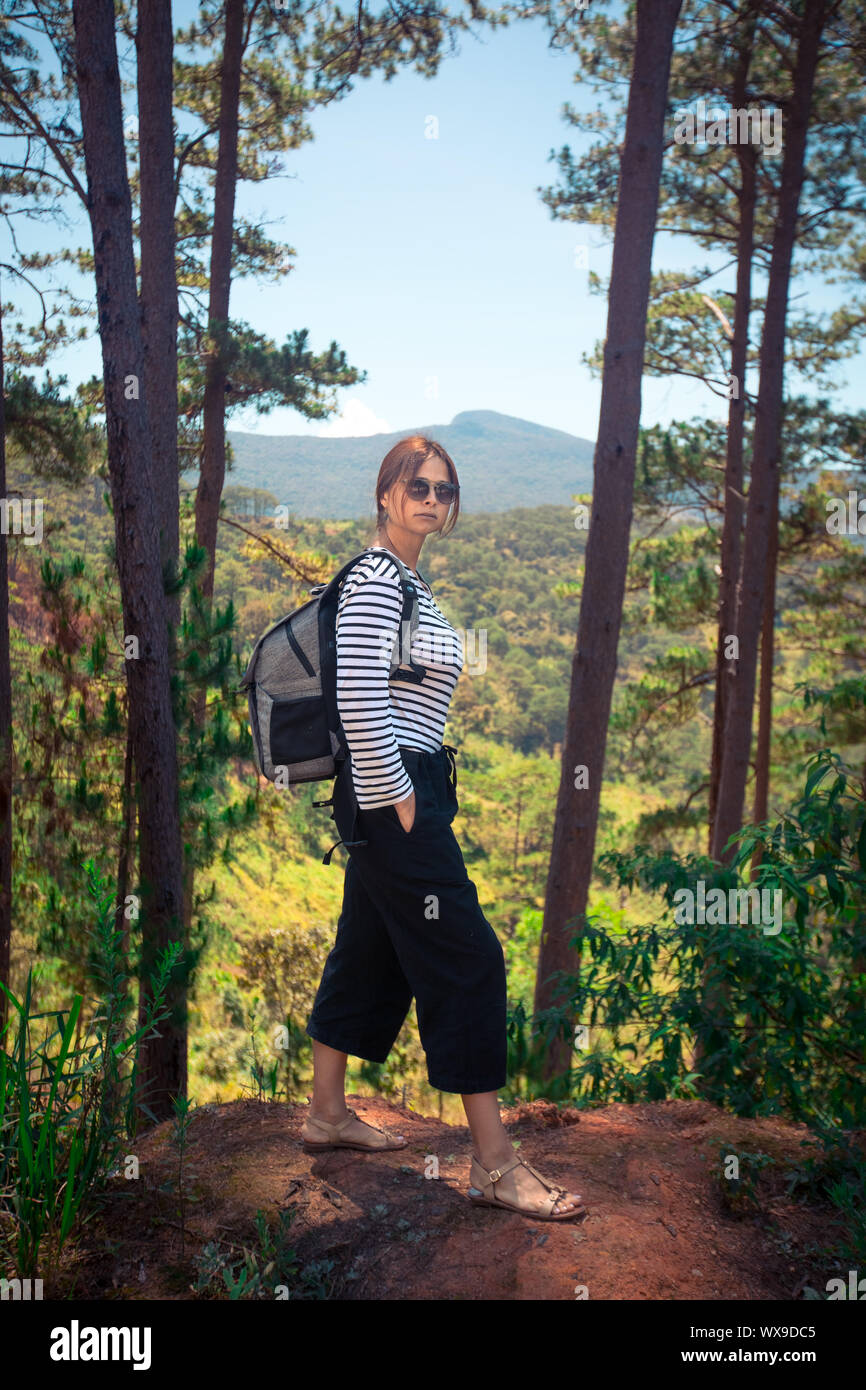 Tourist with backpack in highland Stock Photo - Alamy