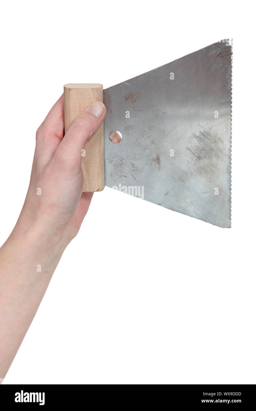 Hand holding a spreader Stock Photo - Alamy