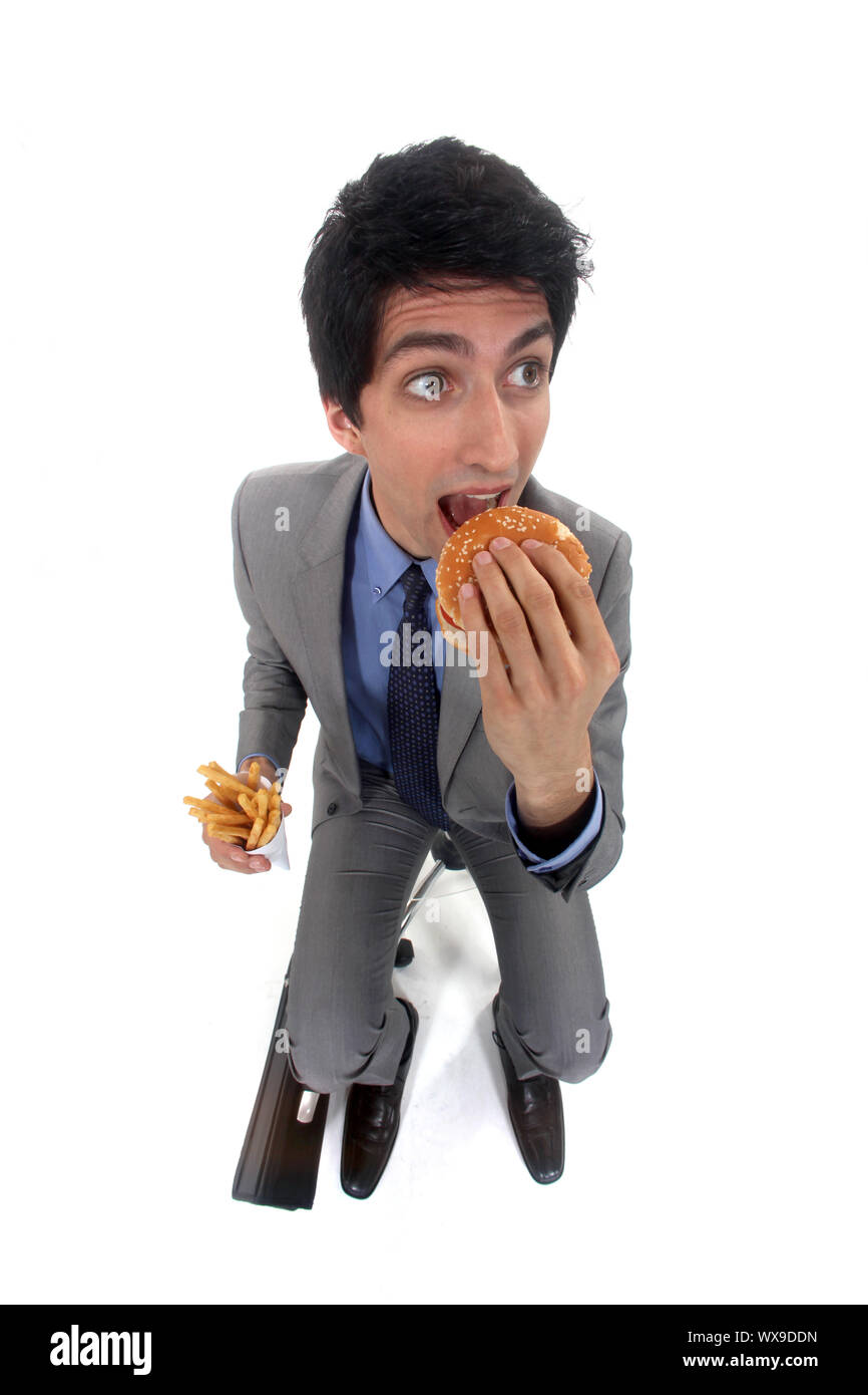 Man eating burger chips Cut Out Stock Images & Pictures - Alamy