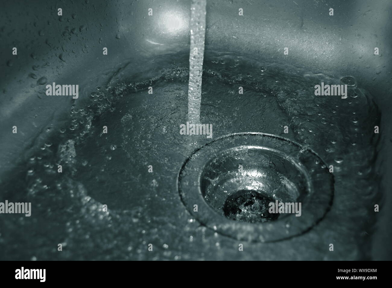 water flow into the drain in the kitchen Stock Photo - Alamy