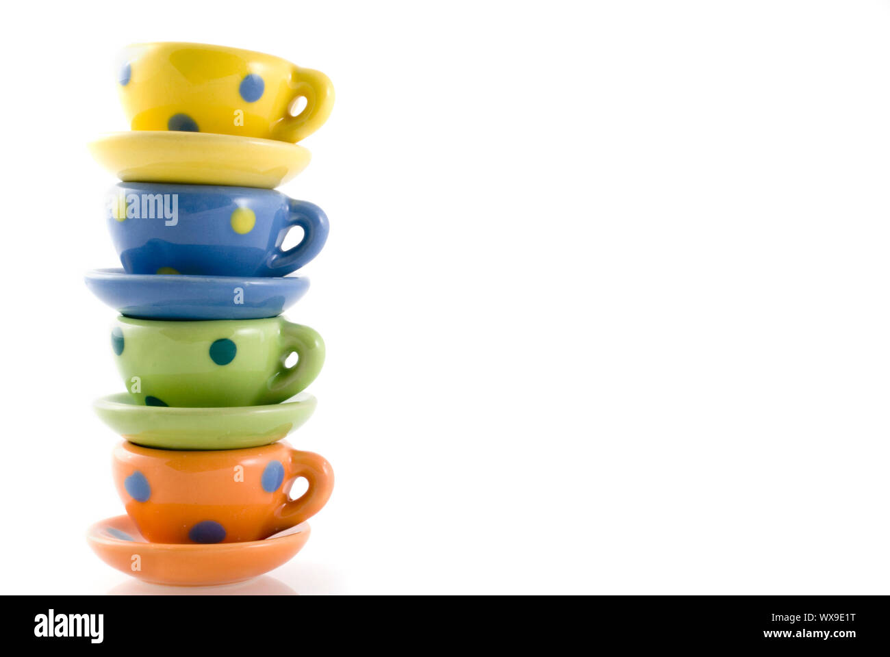 a pile of colorful cups on the left side Stock Photo - Alamy