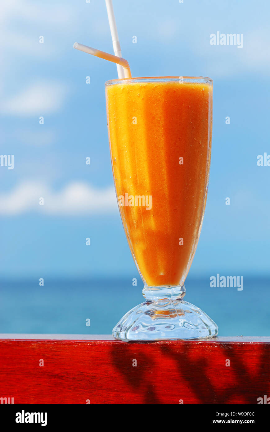 Cocktail. Sea in background Stock Photo - Alamy