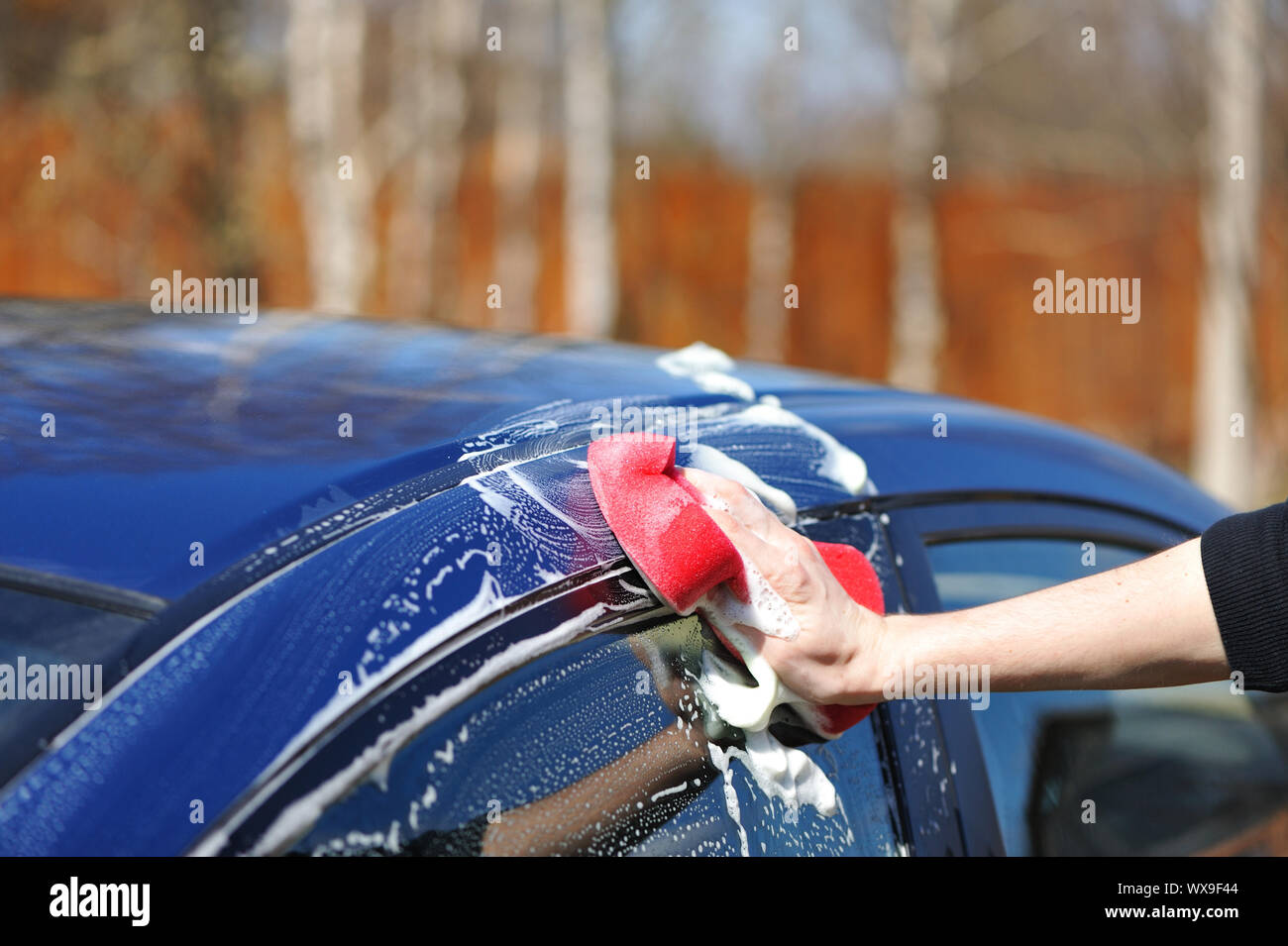Blue car washing on open air Stock Photo - Alamy