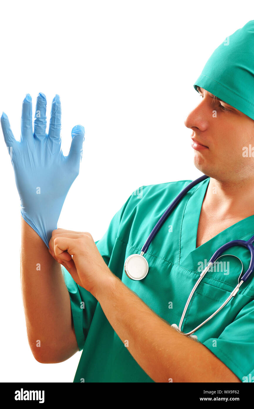 Doctor pulling on surgical glove Stock Photo - Alamy