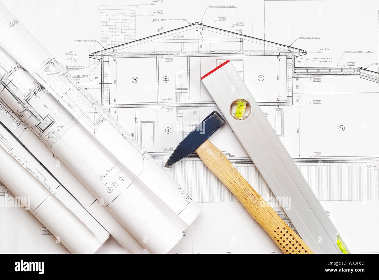 Tools over house plan blueprints Stock Photo - Alamy