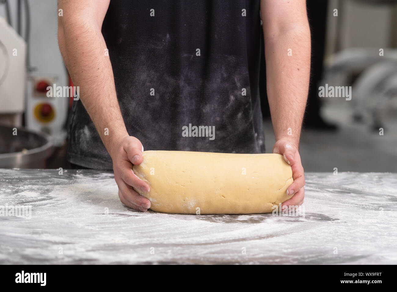 Baker kneading fresh raw bread dough at the bakery Stock Photo - Alamy
