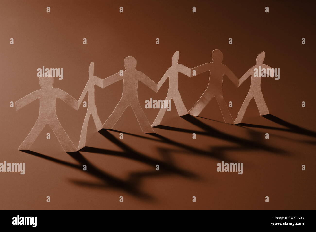 paper people doing teamwork in their business Stock Photo - Alamy