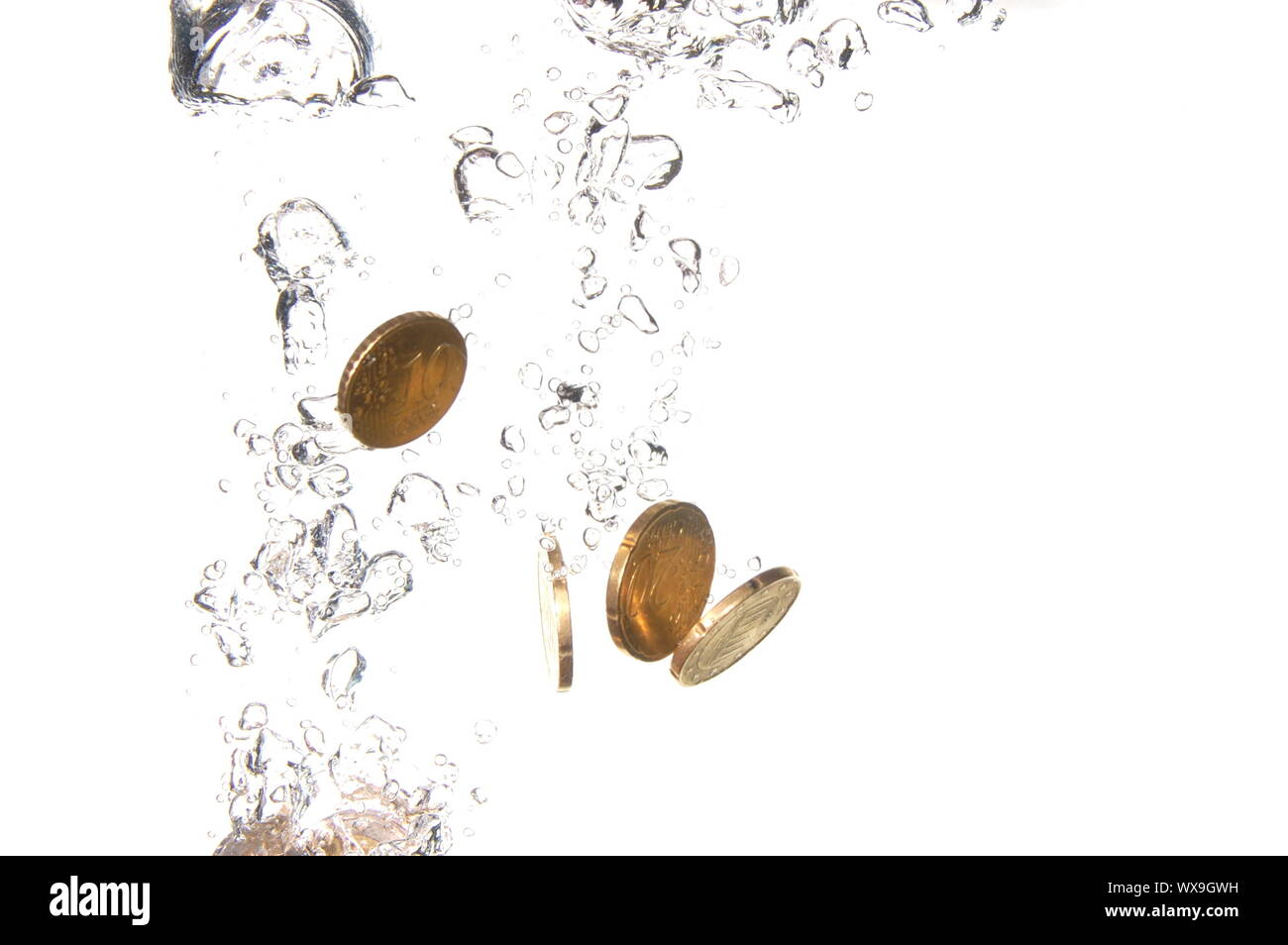 money in water with bubbles on white background Stock Photo - Alamy