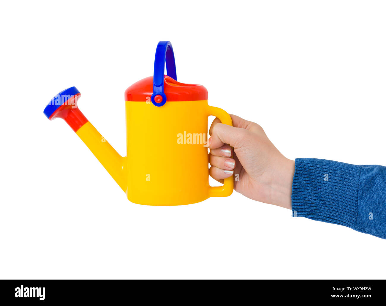 Hand with watering can Stock Photo - Alamy