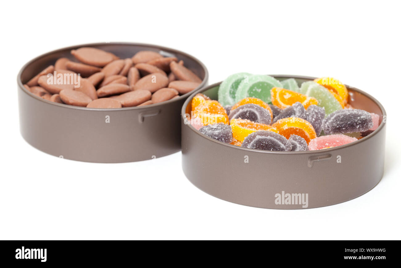 Colorful Jelly and Chocolate Candies in tin cans, on white background ...