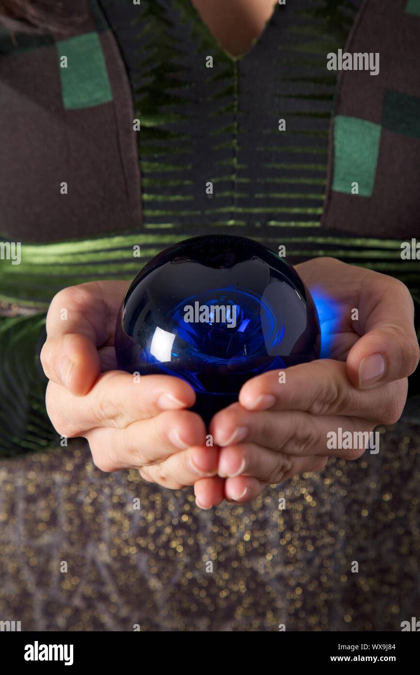 woman hand detail with a blue ball on her palm Stock Photo - Alamy