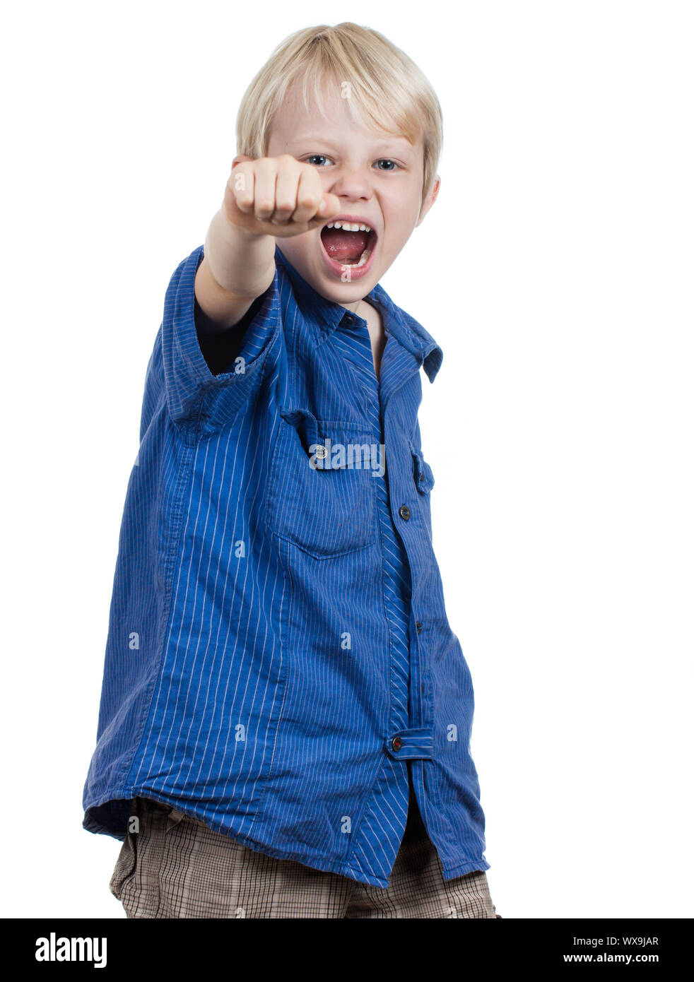 An angry young boy punching and screaming Stock Photo - Alamy