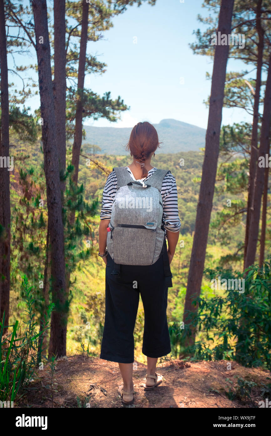 Tourist with backpack in highland Stock Photo - Alamy