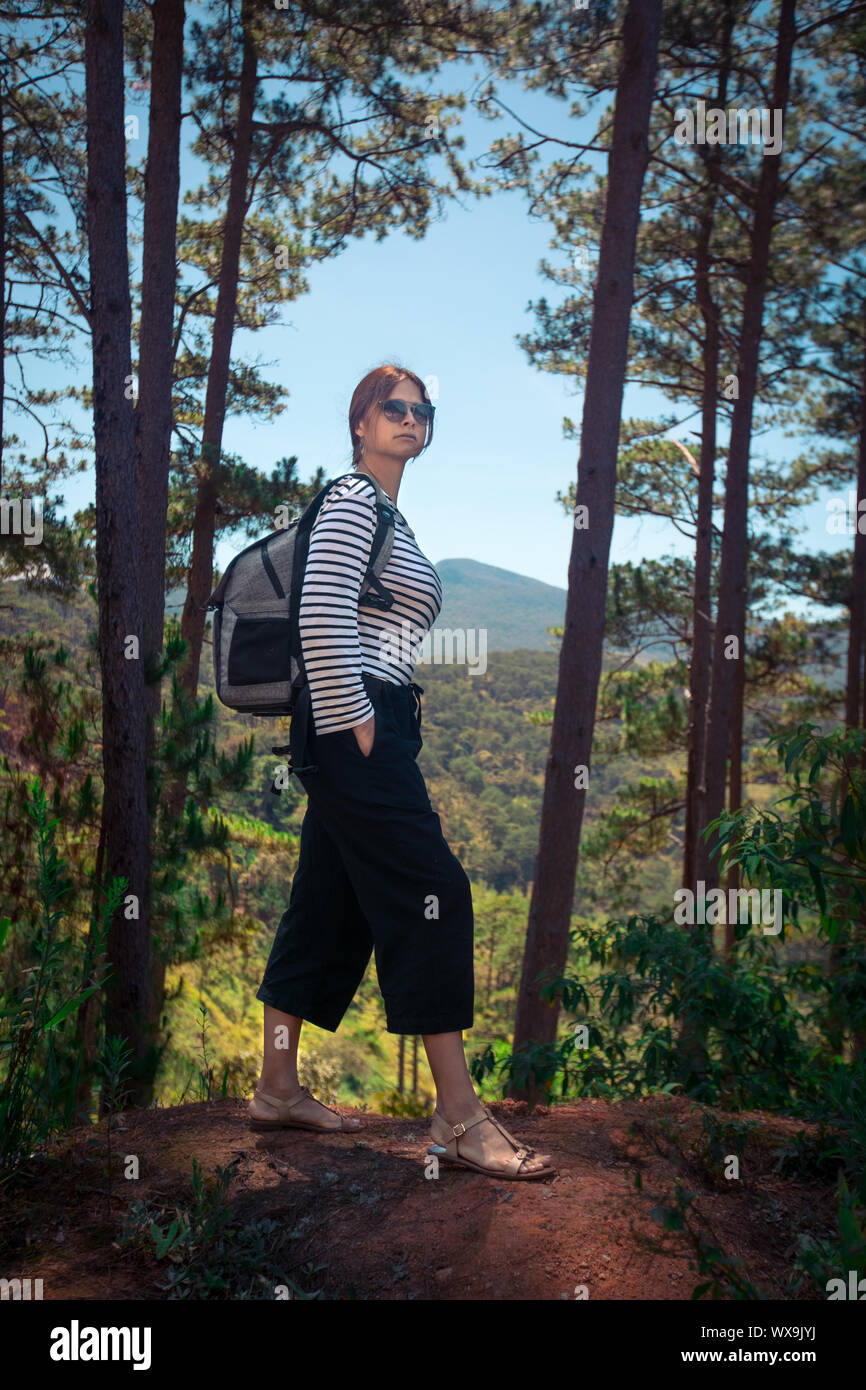 Tourist with backpack in highland Stock Photo - Alamy