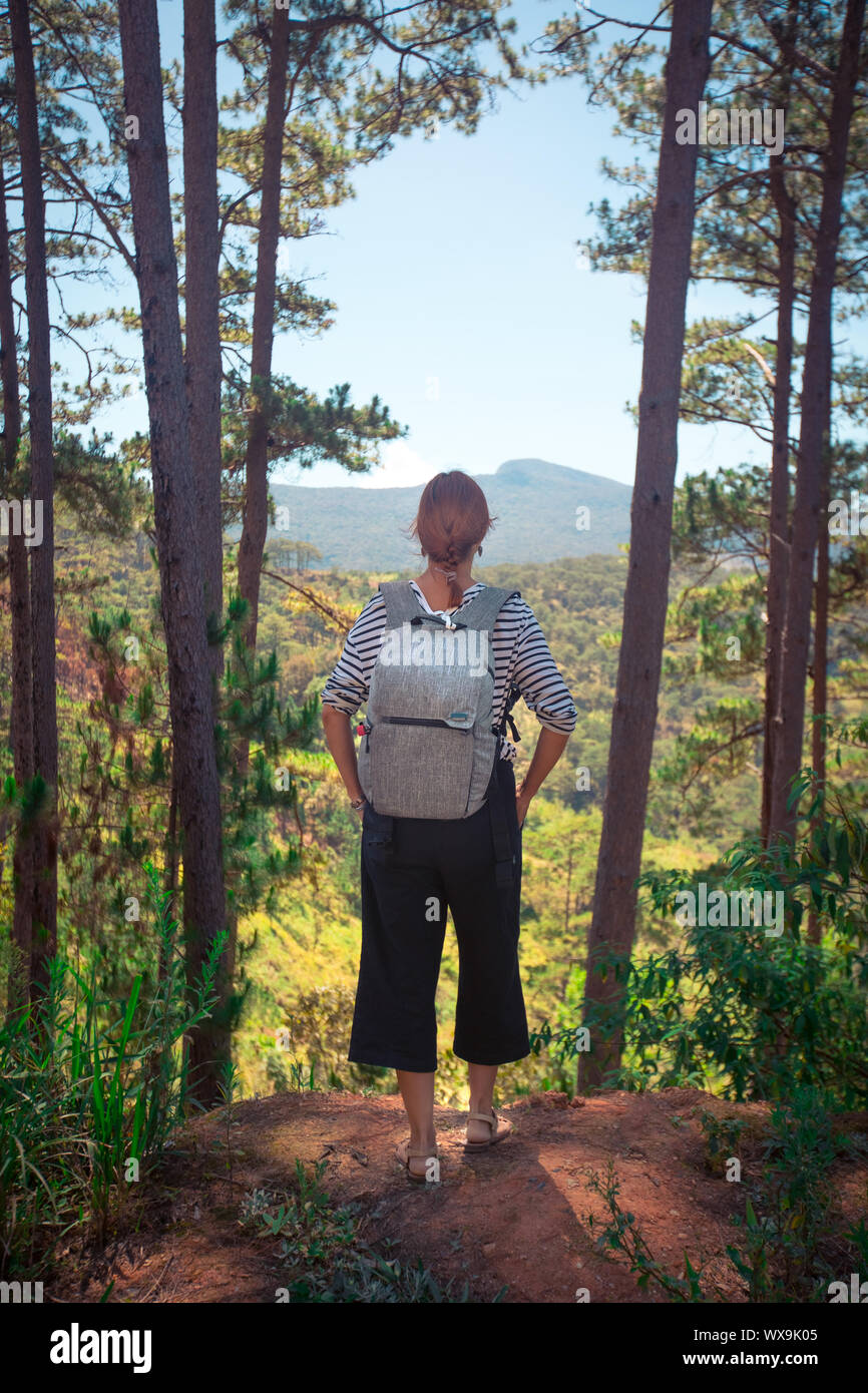 Tourist with backpack in highland Stock Photo - Alamy