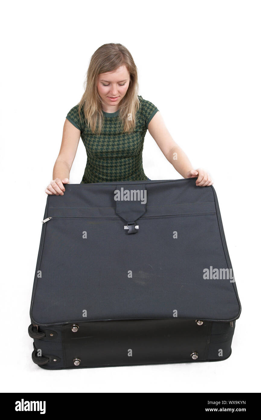 girl is packing clothes on bag Stock Photo - Alamy