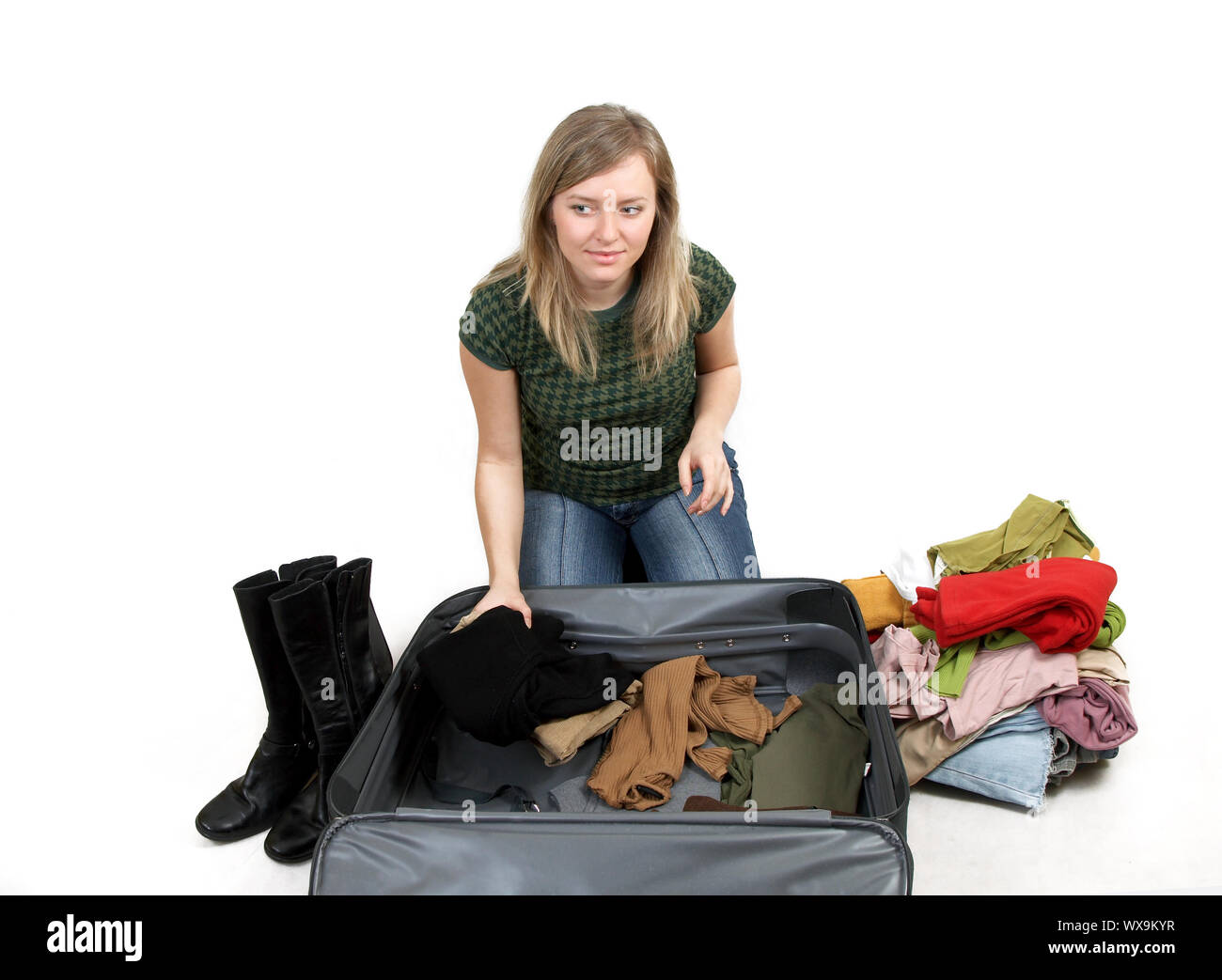 girl is packing clothes Stock Photo - Alamy
