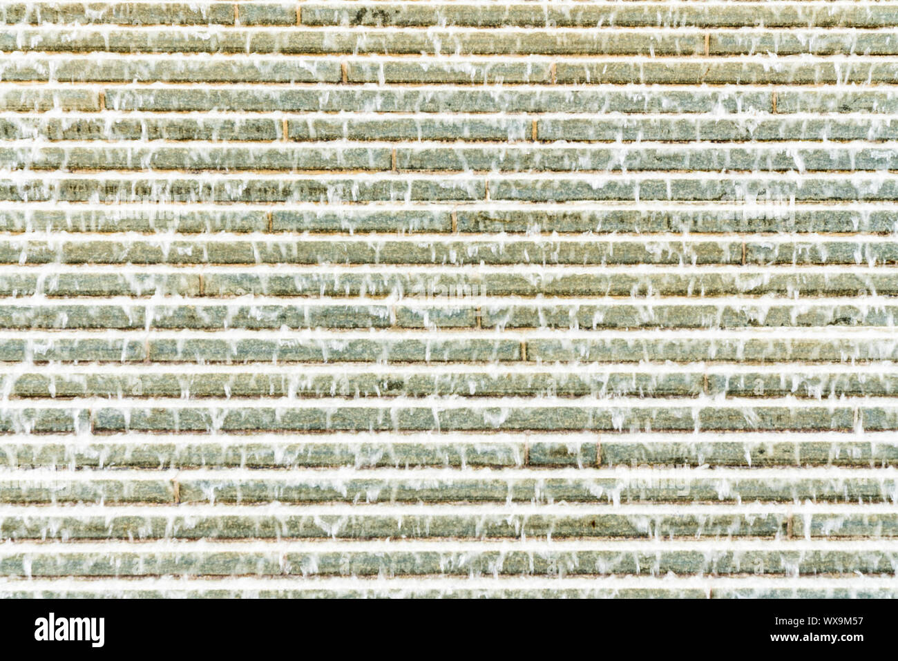 abstract view of an artsy water fountain pyramid with water flowing and ...