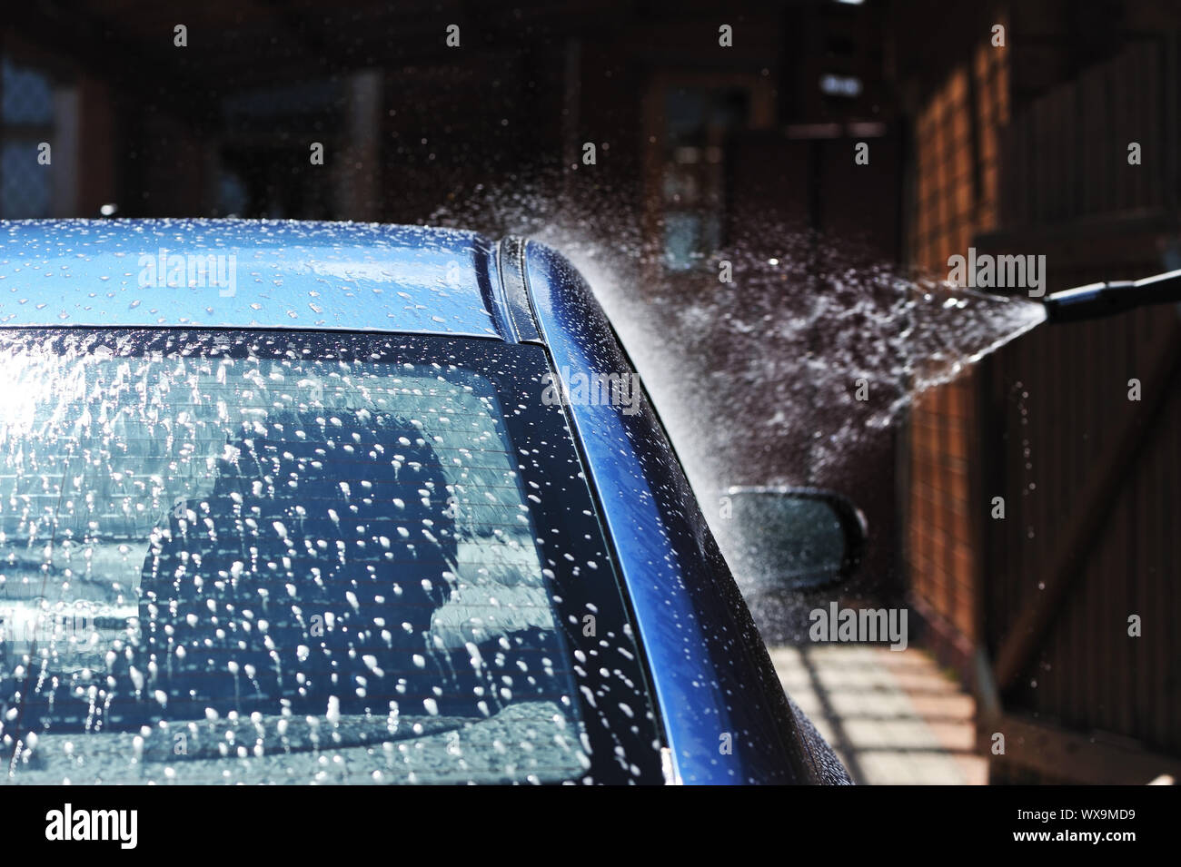 Blue car washing on open air Stock Photo - Alamy