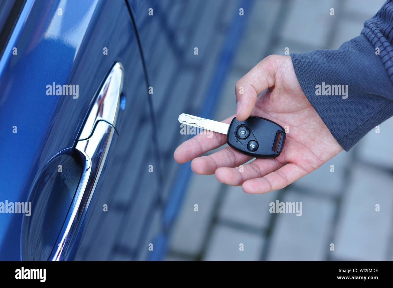 Car key in man's hand Stock Photo - Alamy