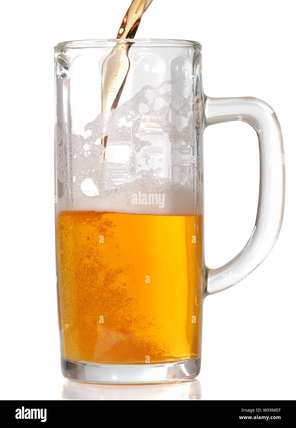 Beer mug isolated on white. Pouring beer in it Stock Photo - Alamy
