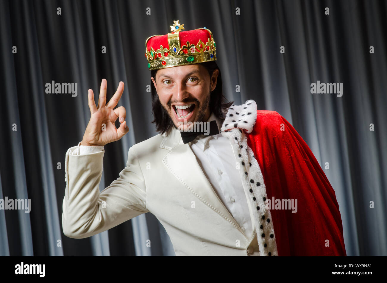Funny king wearing crown in coronation concept Stock Photo - Alamy