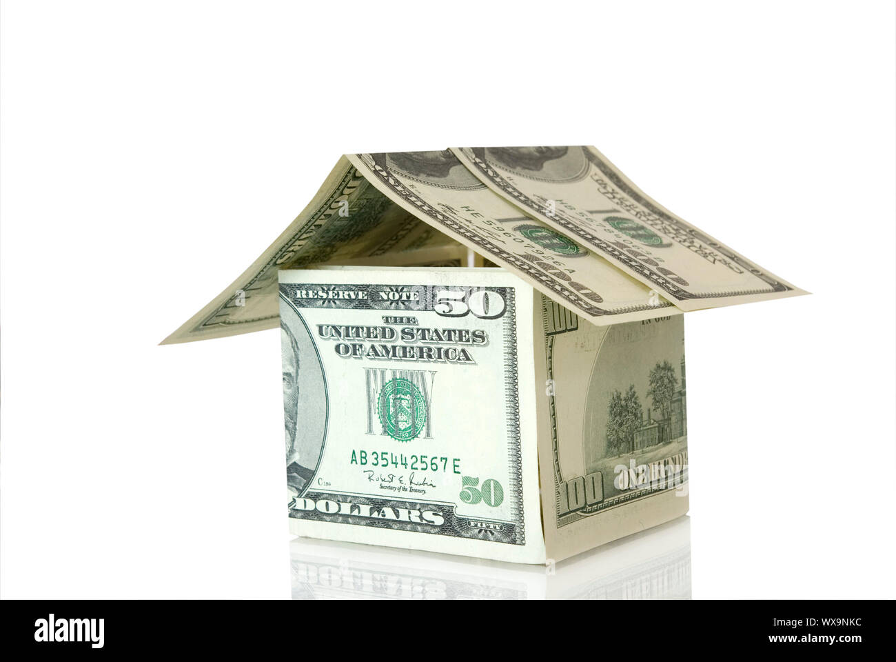 Money house on white background Stock Photo - Alamy