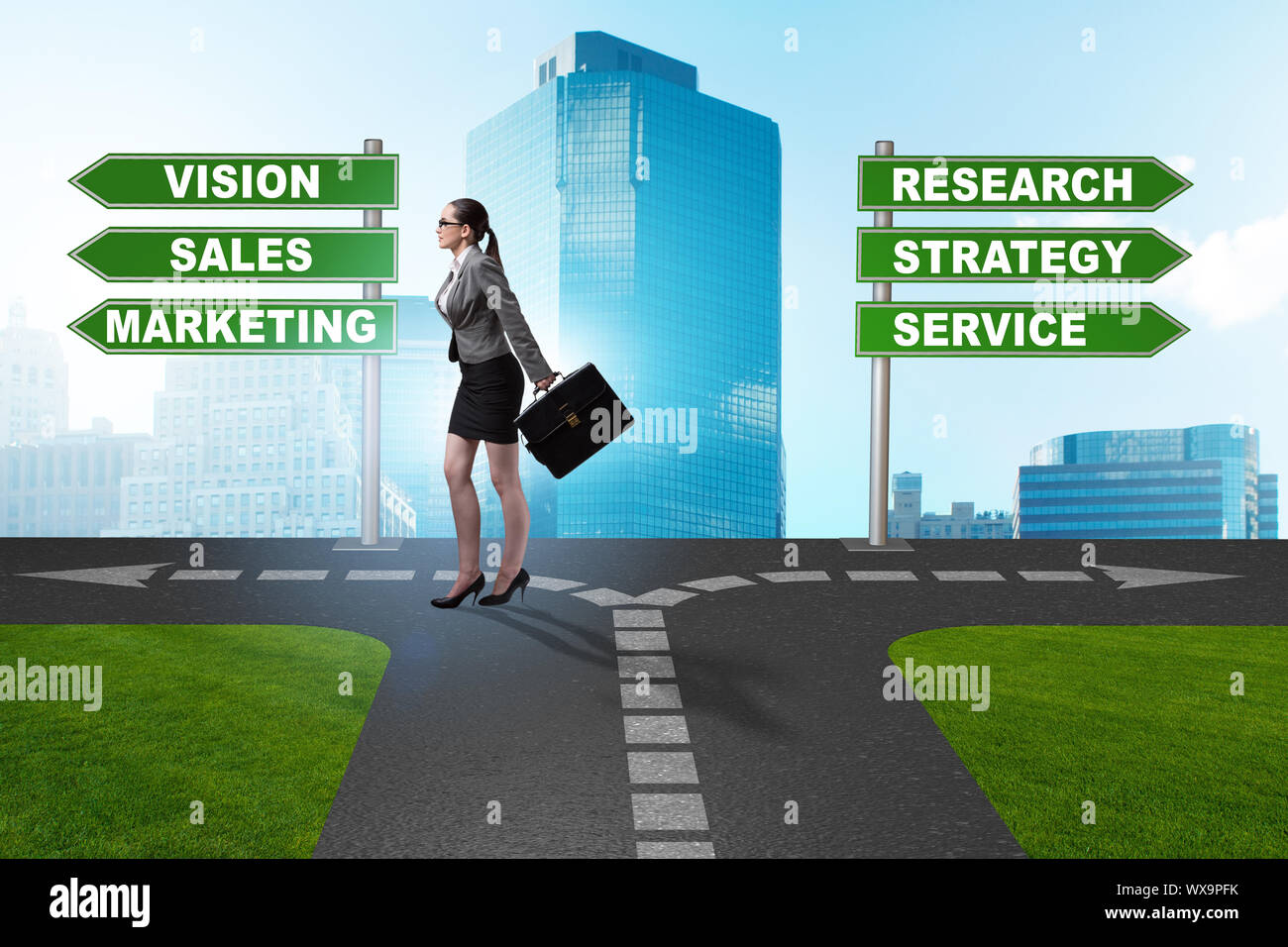 Businesswoman standing at crossroads of corporate strategy Stock Photo ...