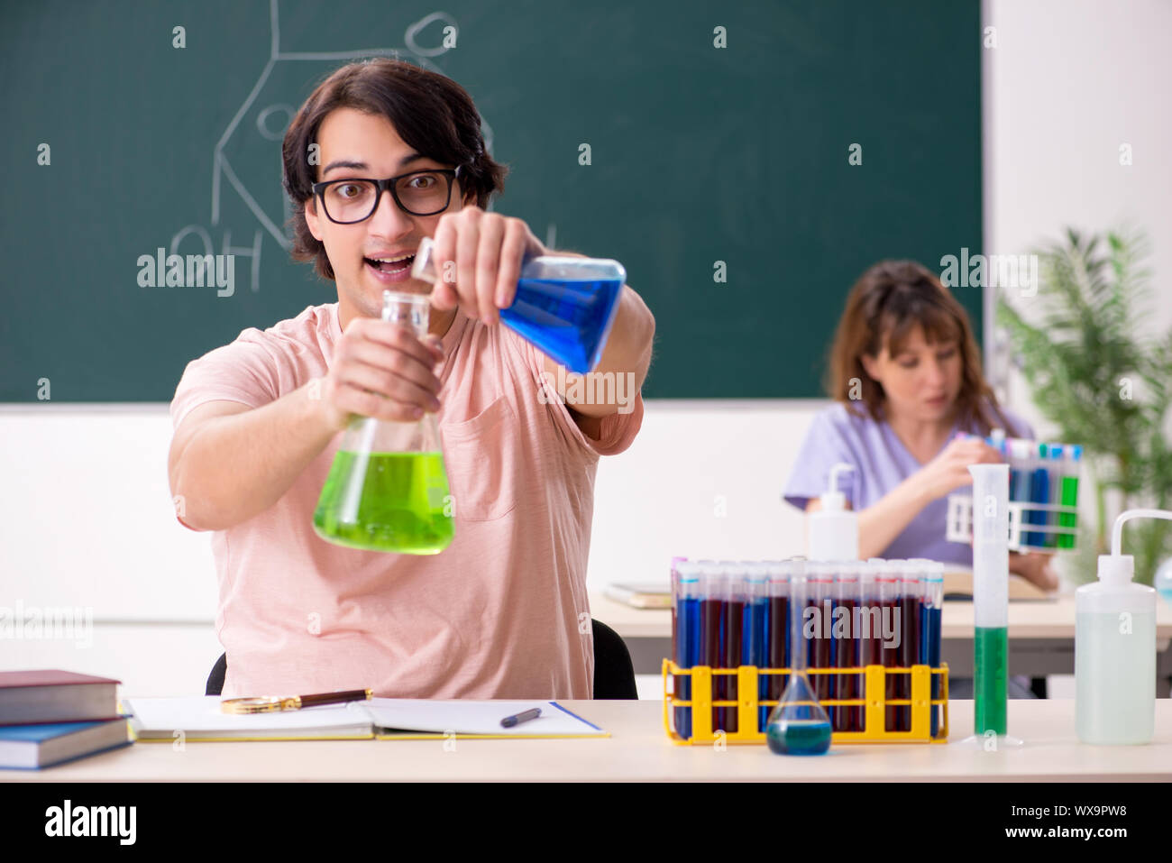 Two chemists students in classroom Stock Photo - Alamy