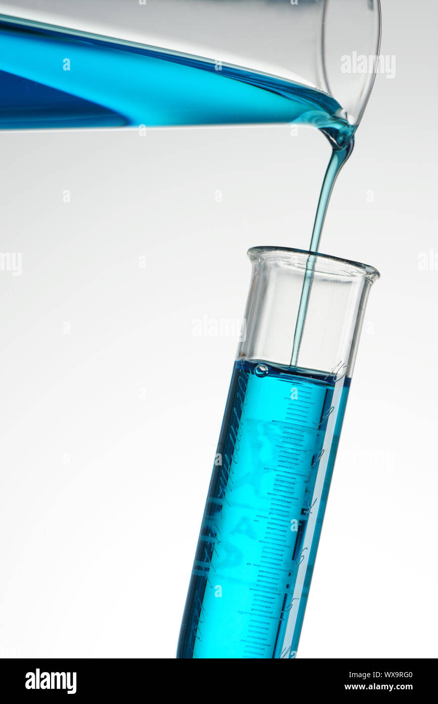 Pouring reagent into test tube Stock Photo - Alamy