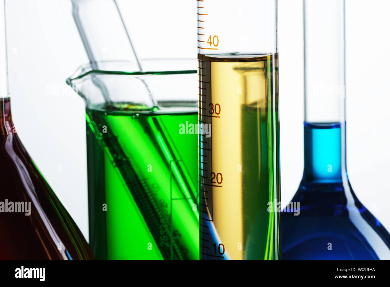 Chemical flasks with reagents isolated on white background Stock Photo ...