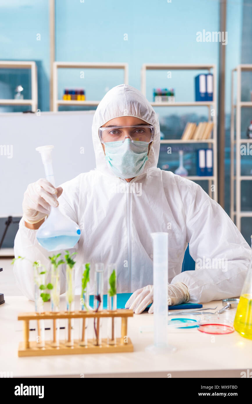 Male biotechnology scientist chemist working in the lab Stock Photo - Alamy