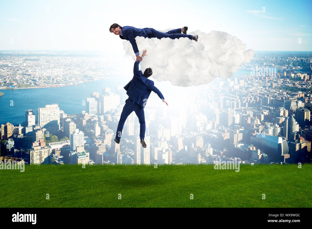 Businessman pulling falling hi-res stock photography and images - Alamy
