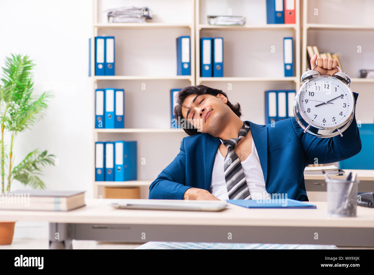 Employee coming to work straight from bed Stock Photo - Alamy