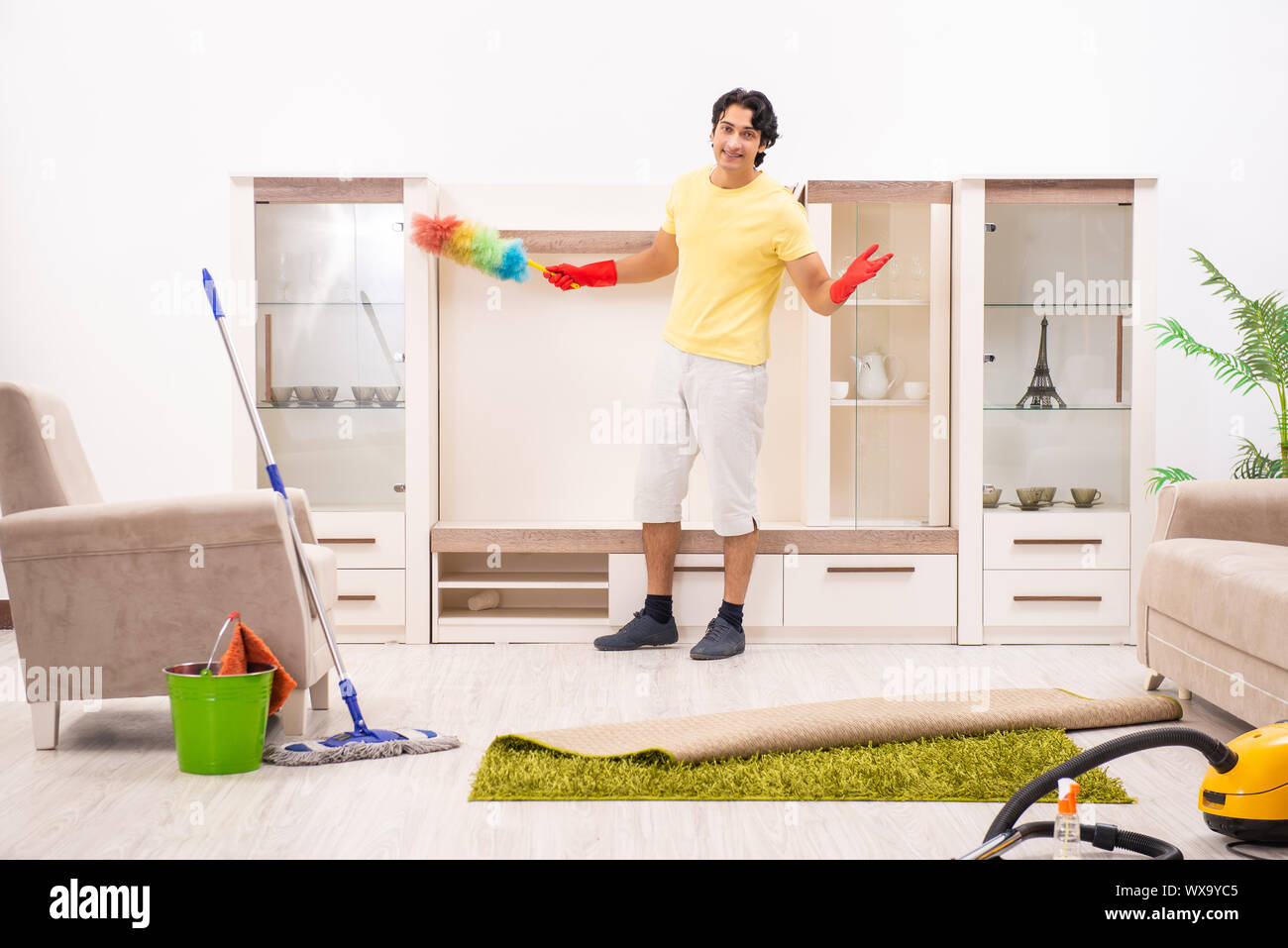 Young handsome man doing housework Stock Photo - Alamy