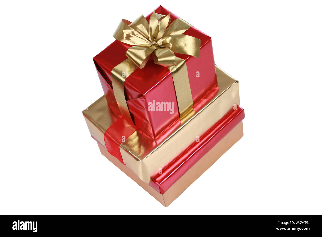 Elegant red and gold presents stacked, isolated Stock Photo - Alamy