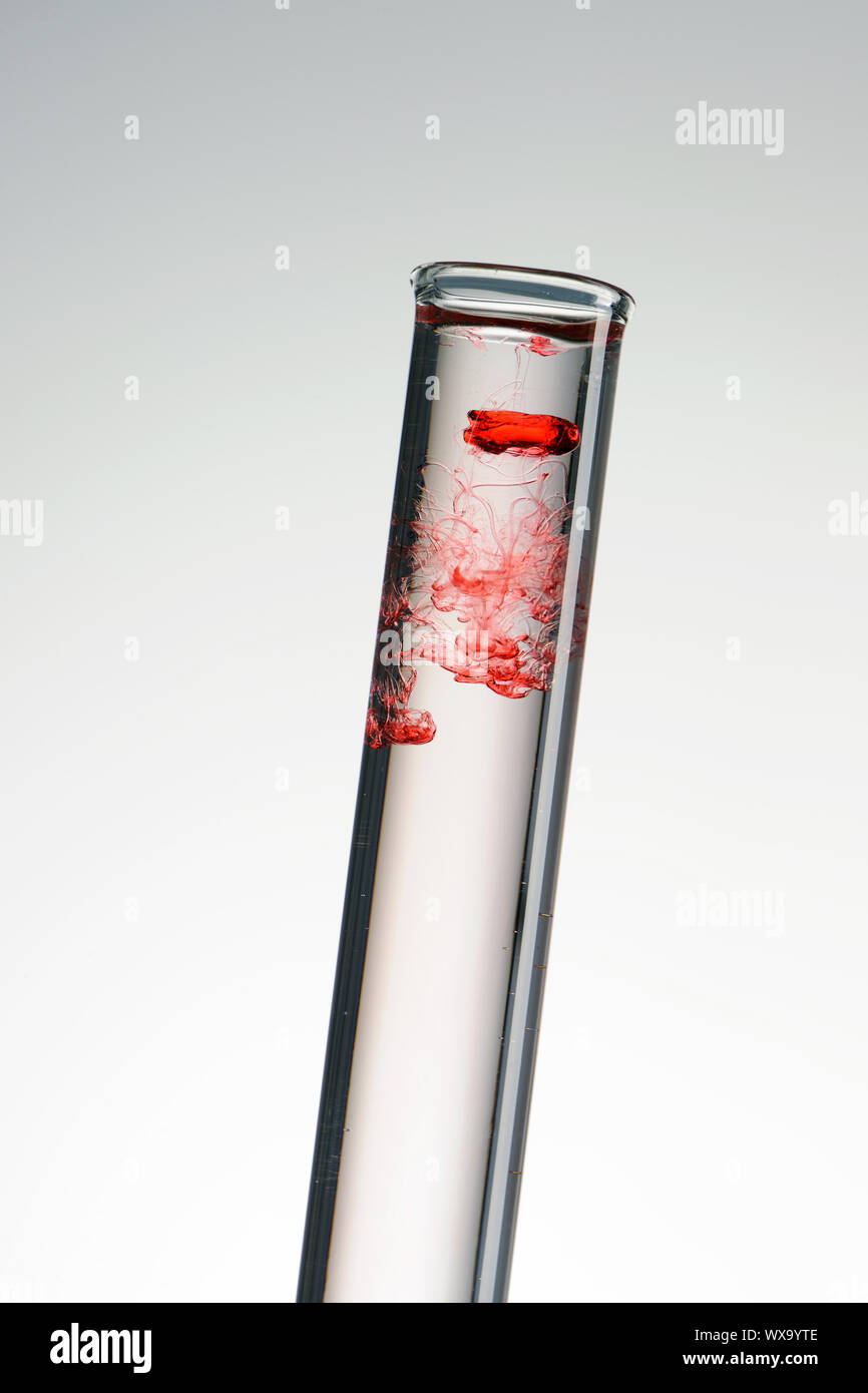 Test tube with red reagent close-up Stock Photo - Alamy