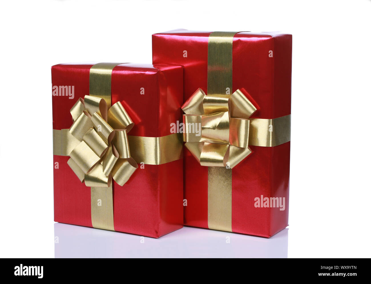 Elegant red presents with gold ribbons isolated on white Stock Photo ...